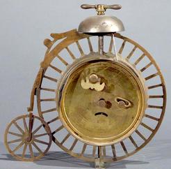 Alarm Clock; Welsh (EN), High-Wheel Bicycle.