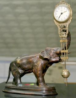 Swing Arm Clock; Junghans, Elephant, 11 inch.