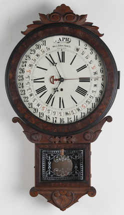 Calendar Clock; Gilbert, Office Drop, Carved Walnut, 34 inch.