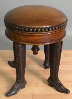Furniture: Stool; Leather Top, Revolving, Iron Boot Legs.