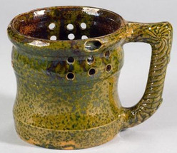George Ohr Pottery; Puzzle Mug, Redware, Green & Yellow Glaze, 4 inch.